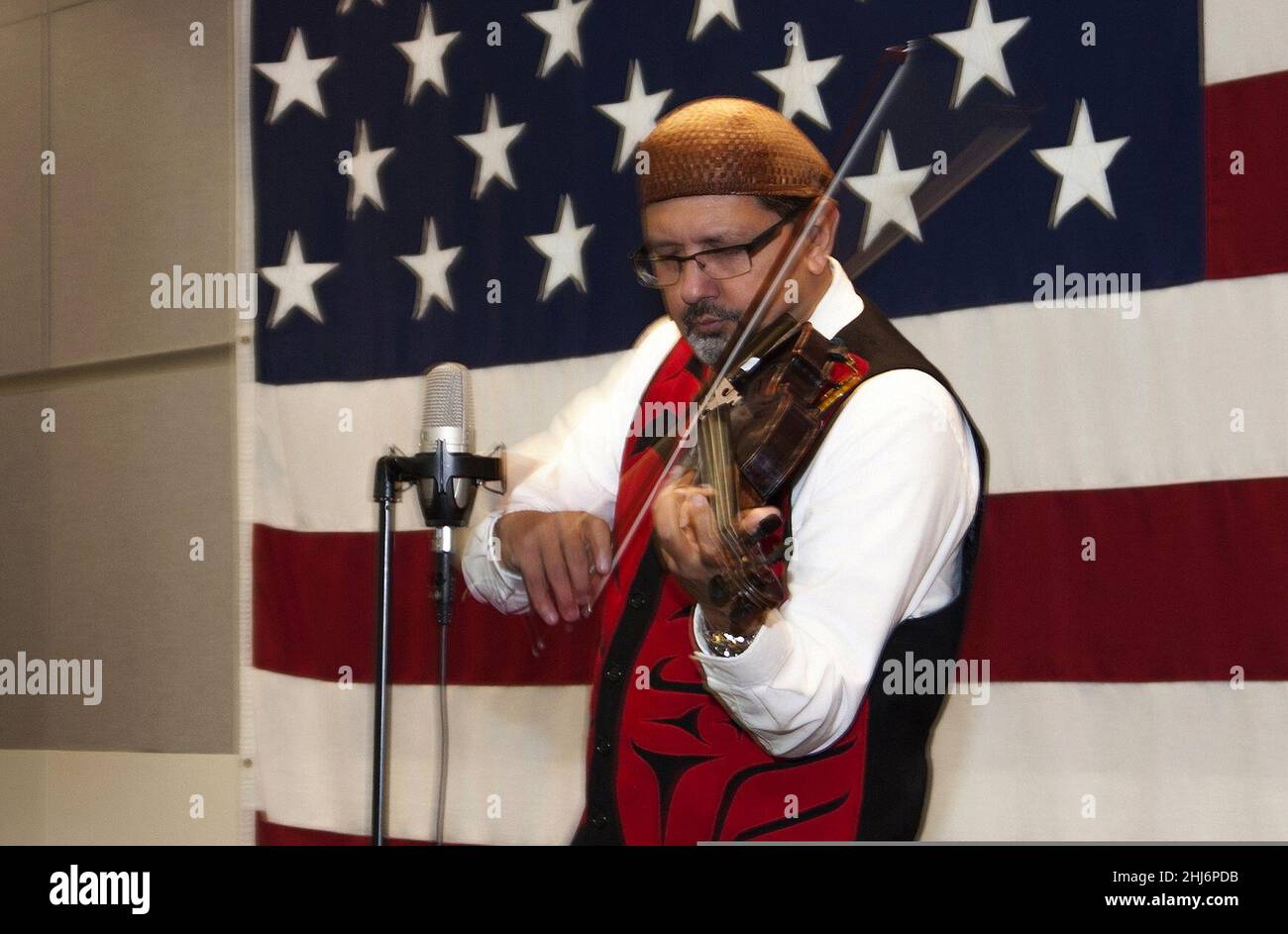 Swil Kanim, a Native American violinist and community advocate, plays ...
