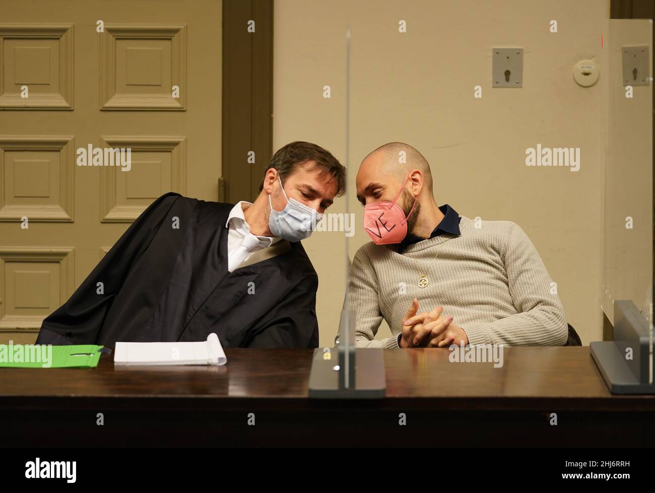 Hamburg, Germany. 27th Jan, 2022. The defendant (r) sits next to ...