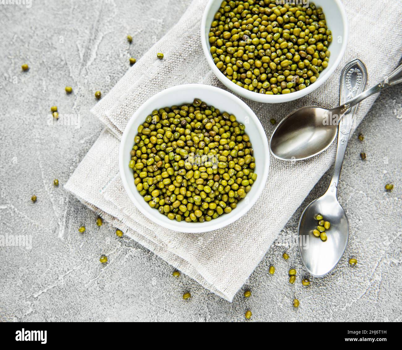 Raw mung beans in the bowls on a grey concrete background Stock Photo ...