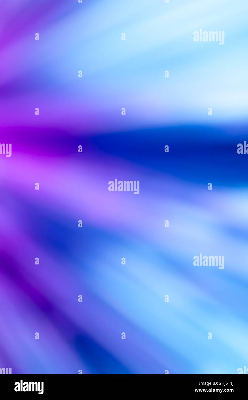 Abstract glowing neon colored background with blurry lines, curves or ...