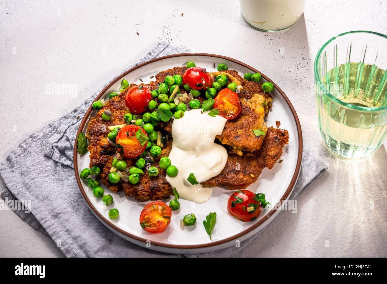 Eating healthy light brunch. Chickpea pancakes Stock Photo - Alamy