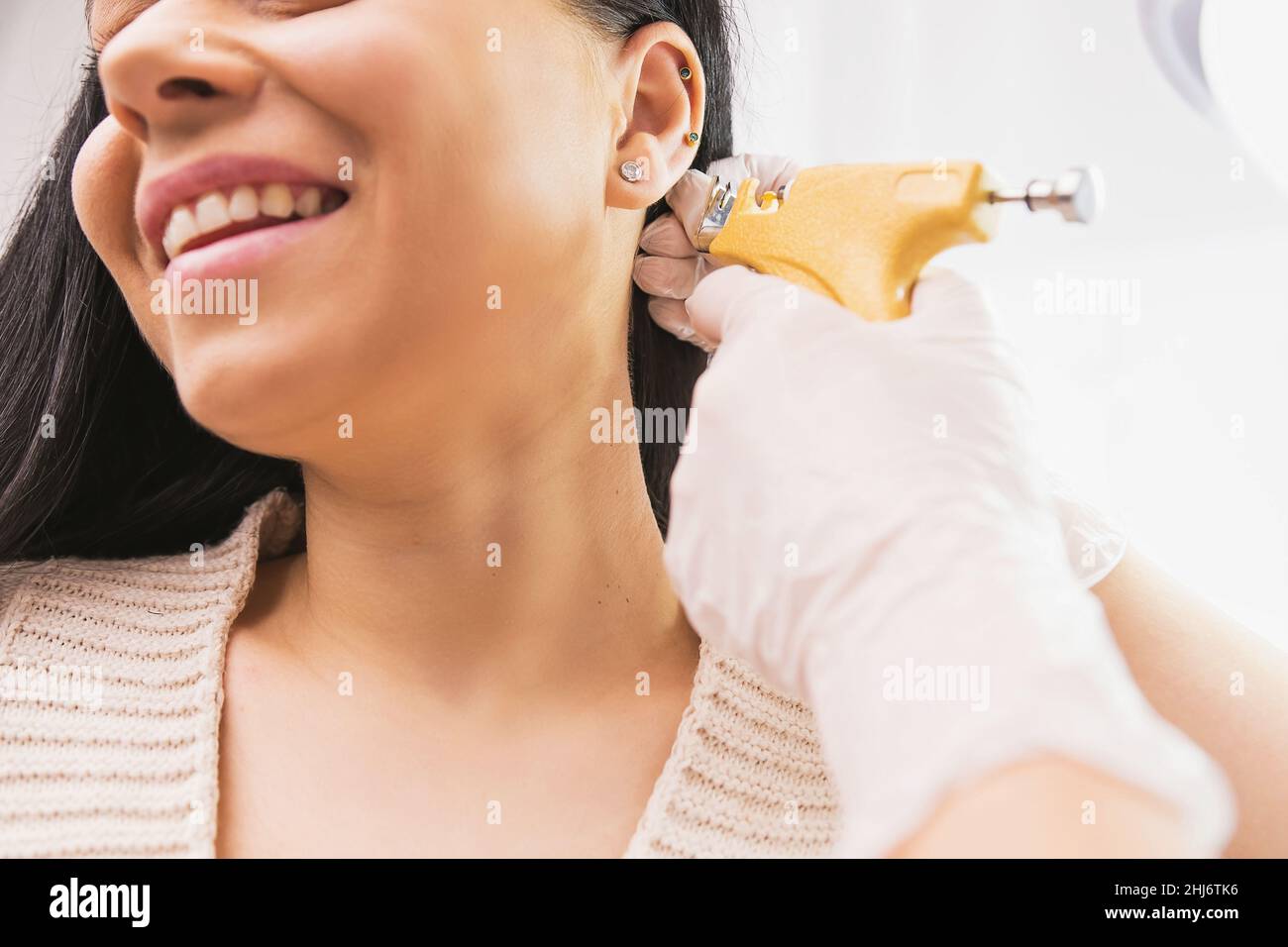 Body piercing procedure hi-res stock photography and images - Alamy