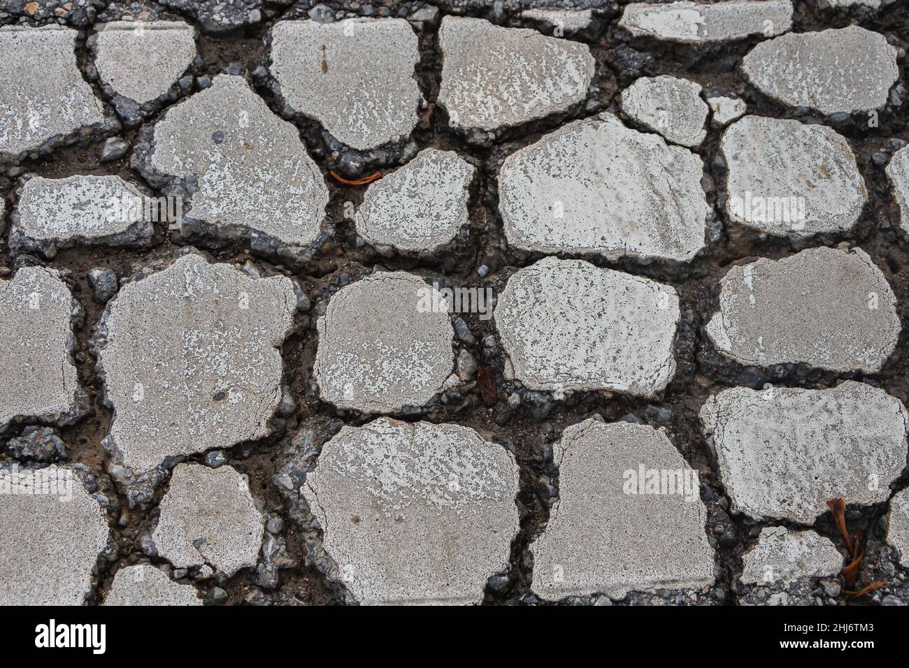 Close-up of a street gray road with raised details. Tile pattern Stock ...