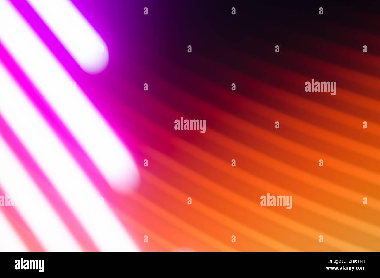 Abstract glowing neon colored background with blurry lines, curves or ...