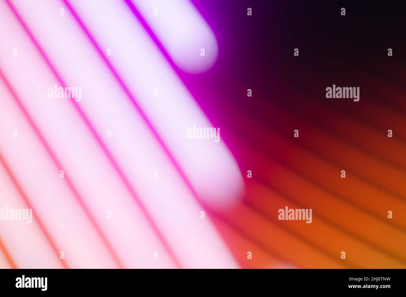 Abstract glowing neon colored background with blurry lines, curves or ...