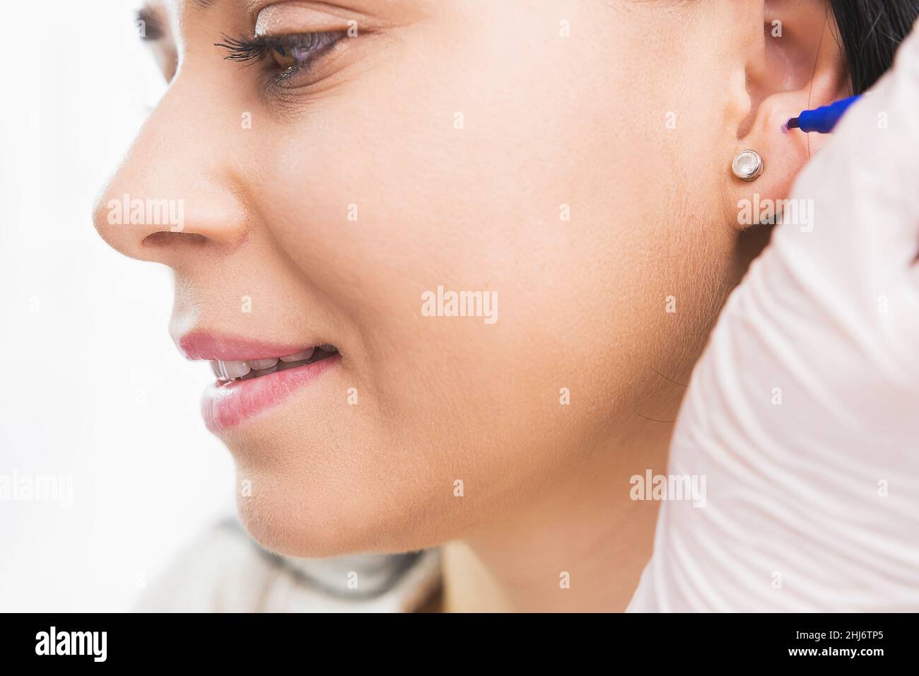 Close up photo of a side of the woman face, specialist female in gloves ...