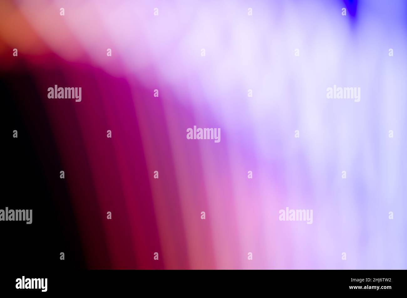 Abstract glowing neon colored background with blurry lines, curves or ...