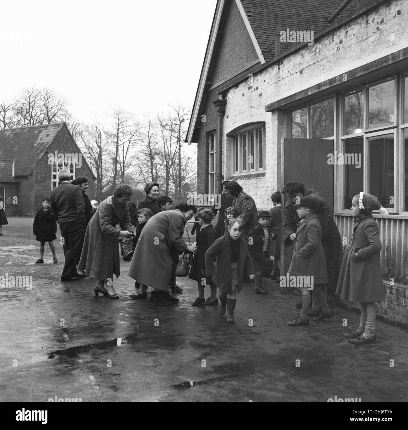 Parents collecting their children from school. 6th December 1957 Stock ...
