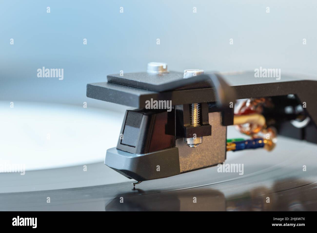 Turntable with black hi-fi Headshell Cartridge in action, dj, audio ...