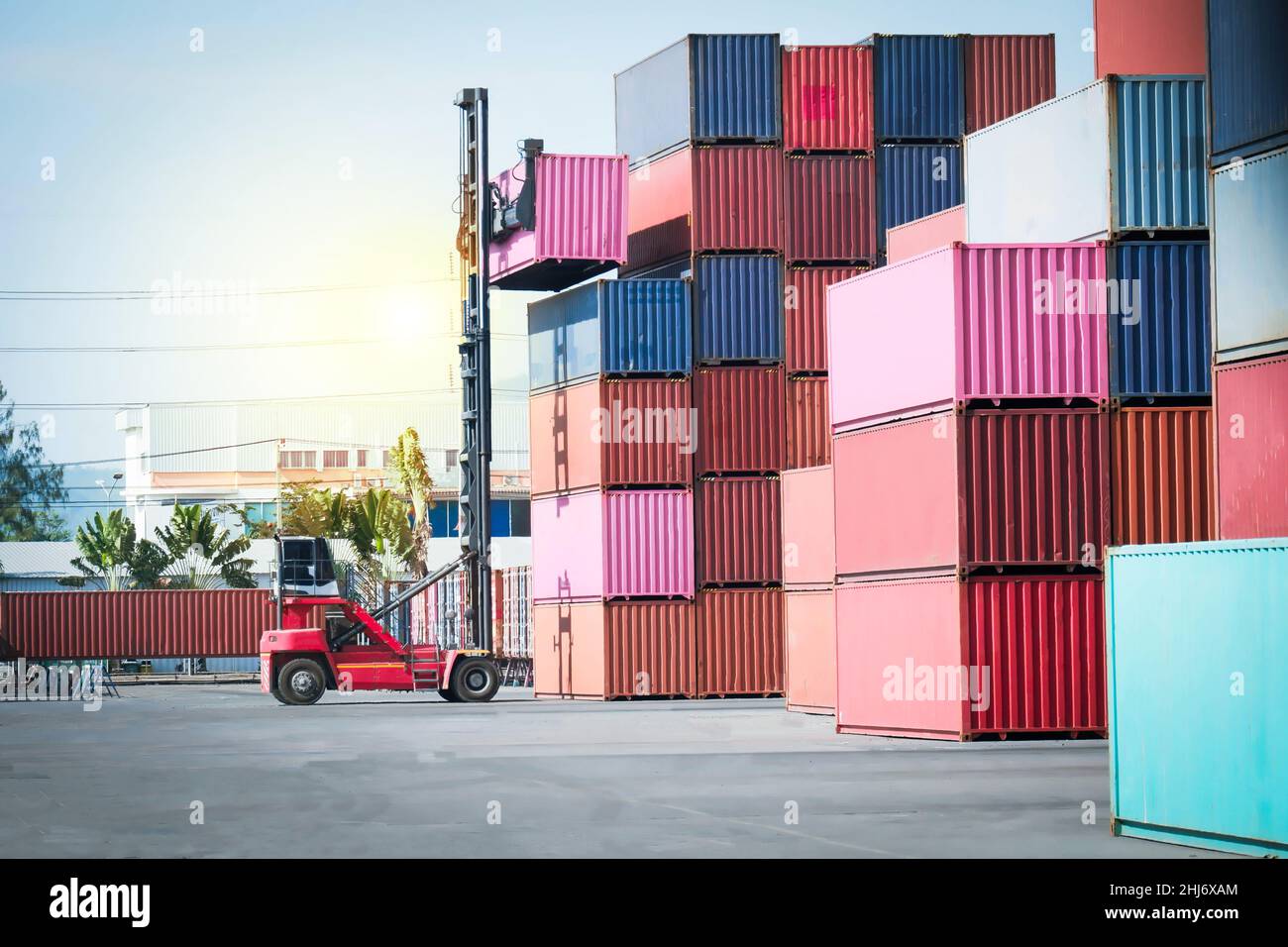 container forklift with a pile of containers beautiful evening ...