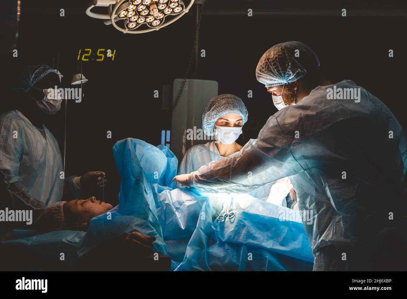 The senior surgeon in the operating room, where the patient is waiting ...