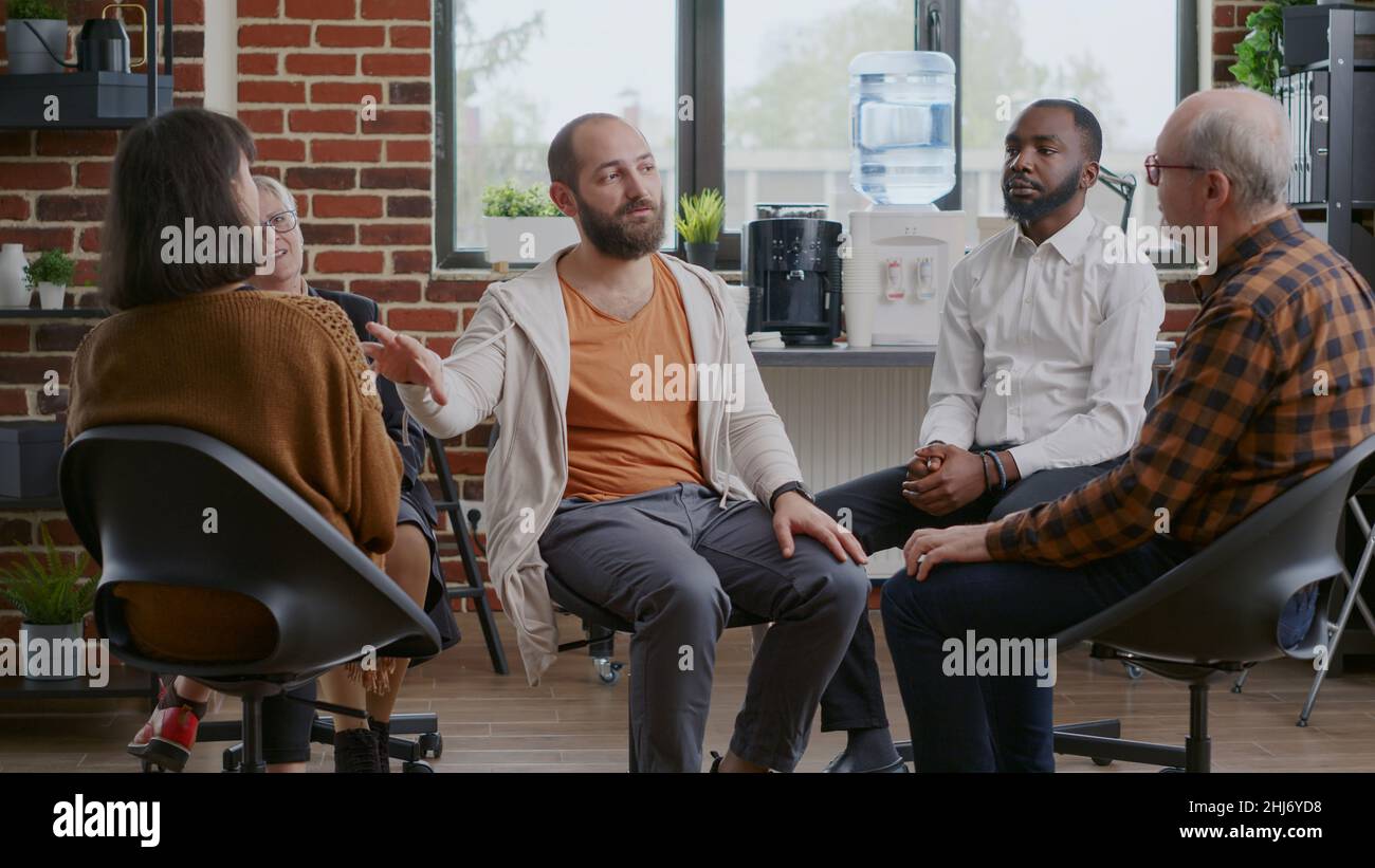 Man doing handshake with people applauding to celebrate therapy ...