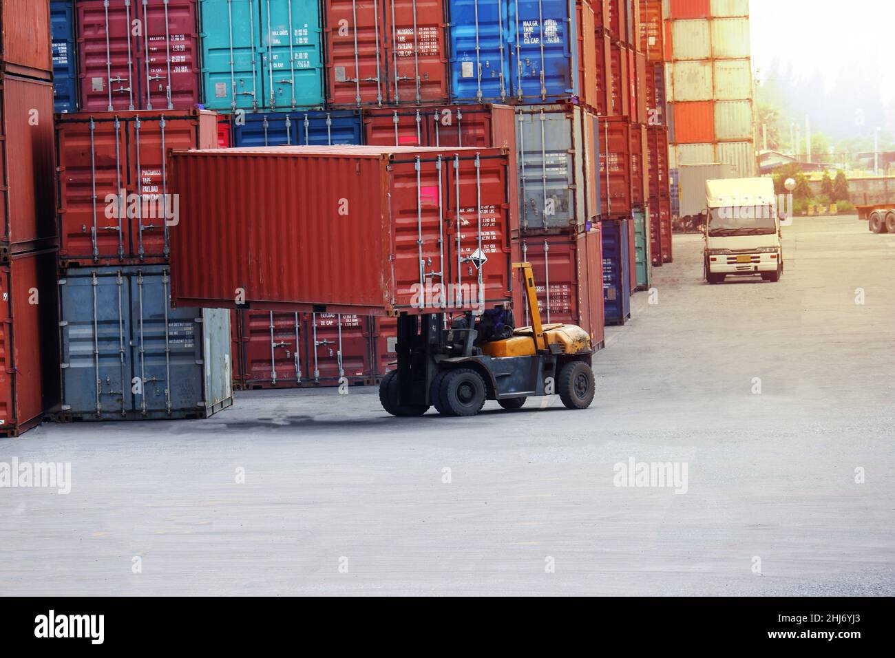 Container forklift in view of container yard industry Stock Photo - Alamy