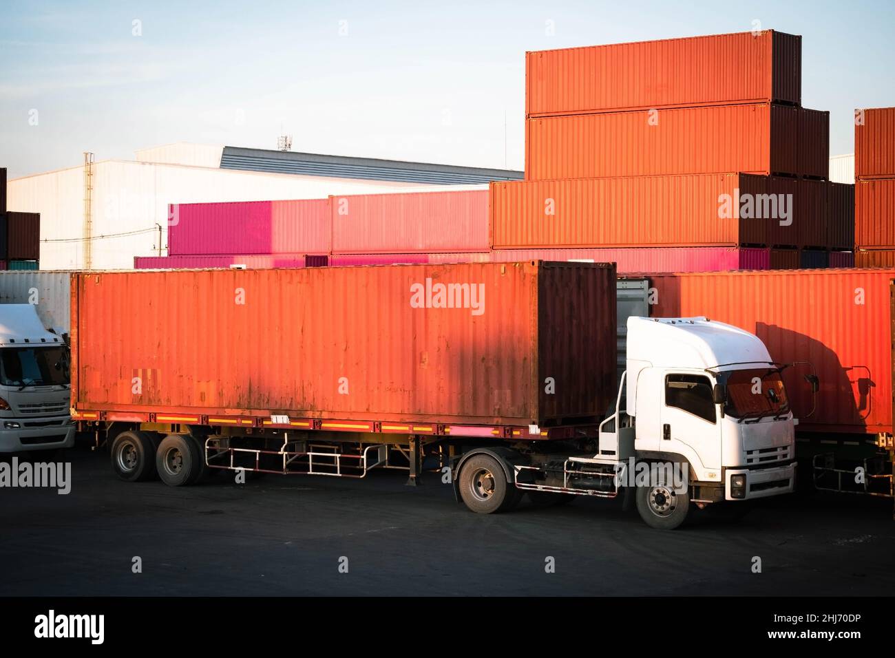 Truck in container yard view of import and export Stock Photo - Alamy