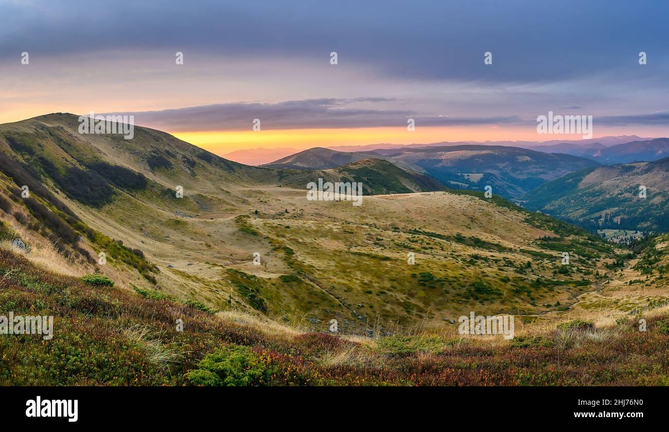 Sunset over mountains landscape. Sun light and mountain sky Stock Photo ...