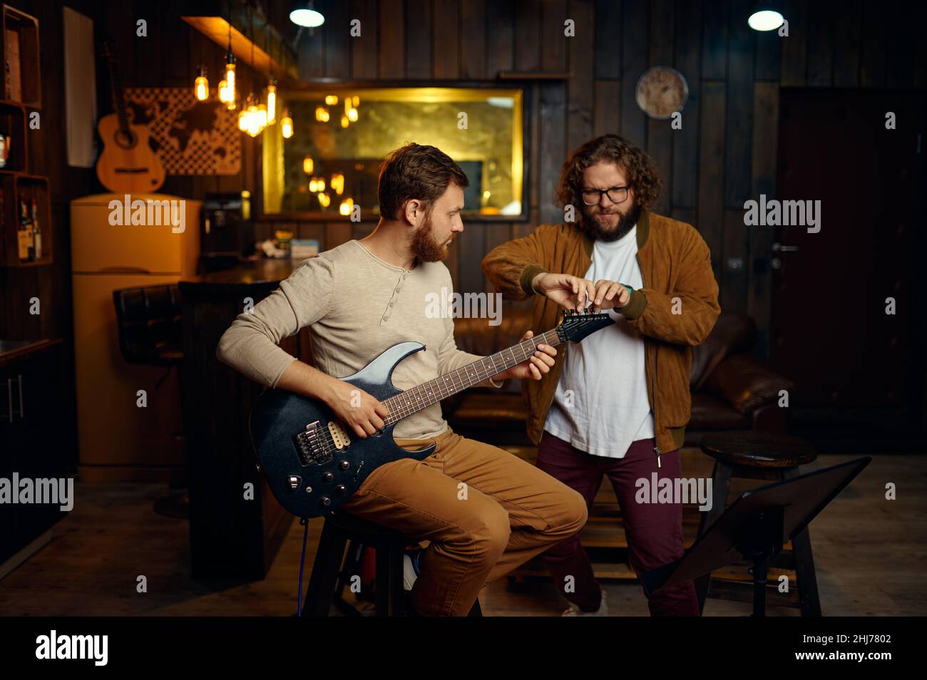 Guitar training music lesson at professional studio Stock Photo - Alamy
