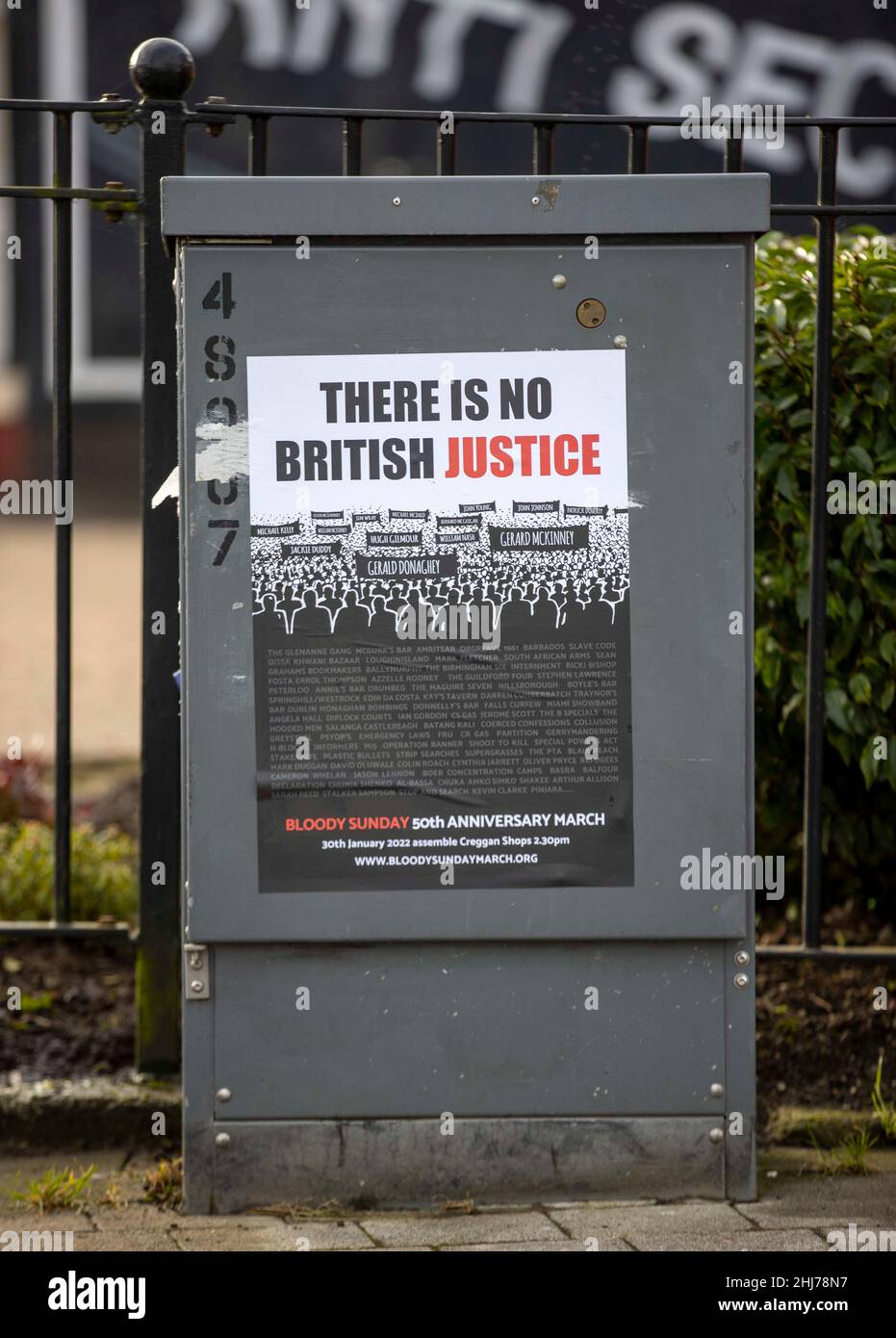 A poster on a phone box for the Bloody Sunday 50th Anniversary March in ...