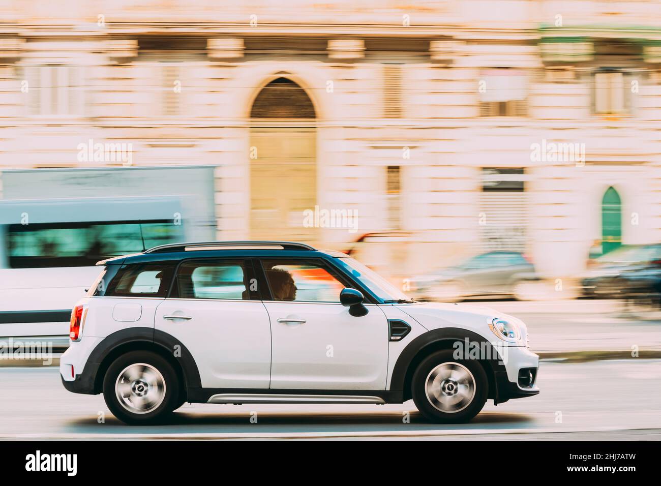 White Color Car Mini Cooper Mini Countryman Fast Moving At City Street ...