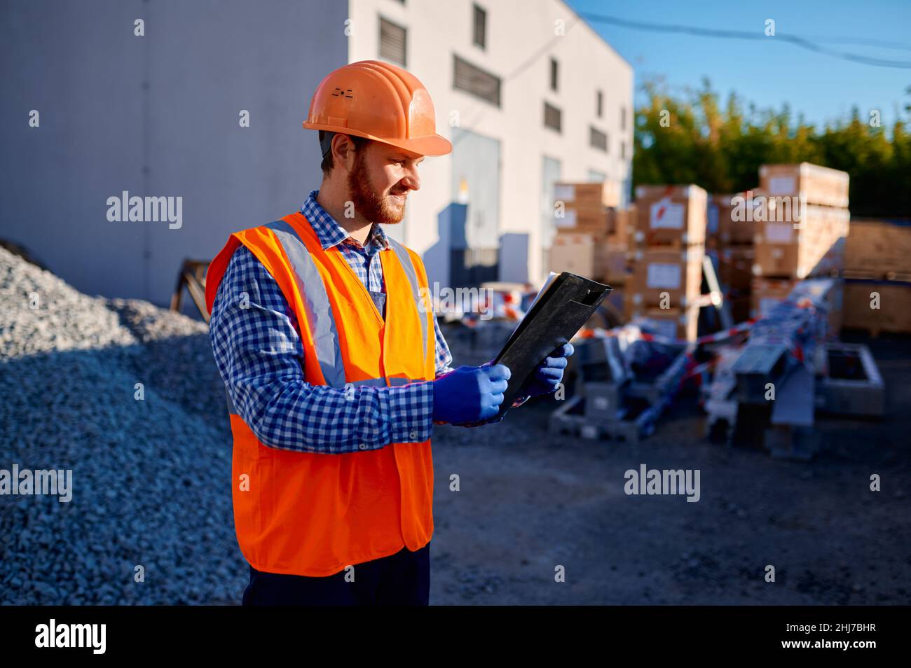 Contractor check delivered parcel at construction site Stock Photo - Alamy