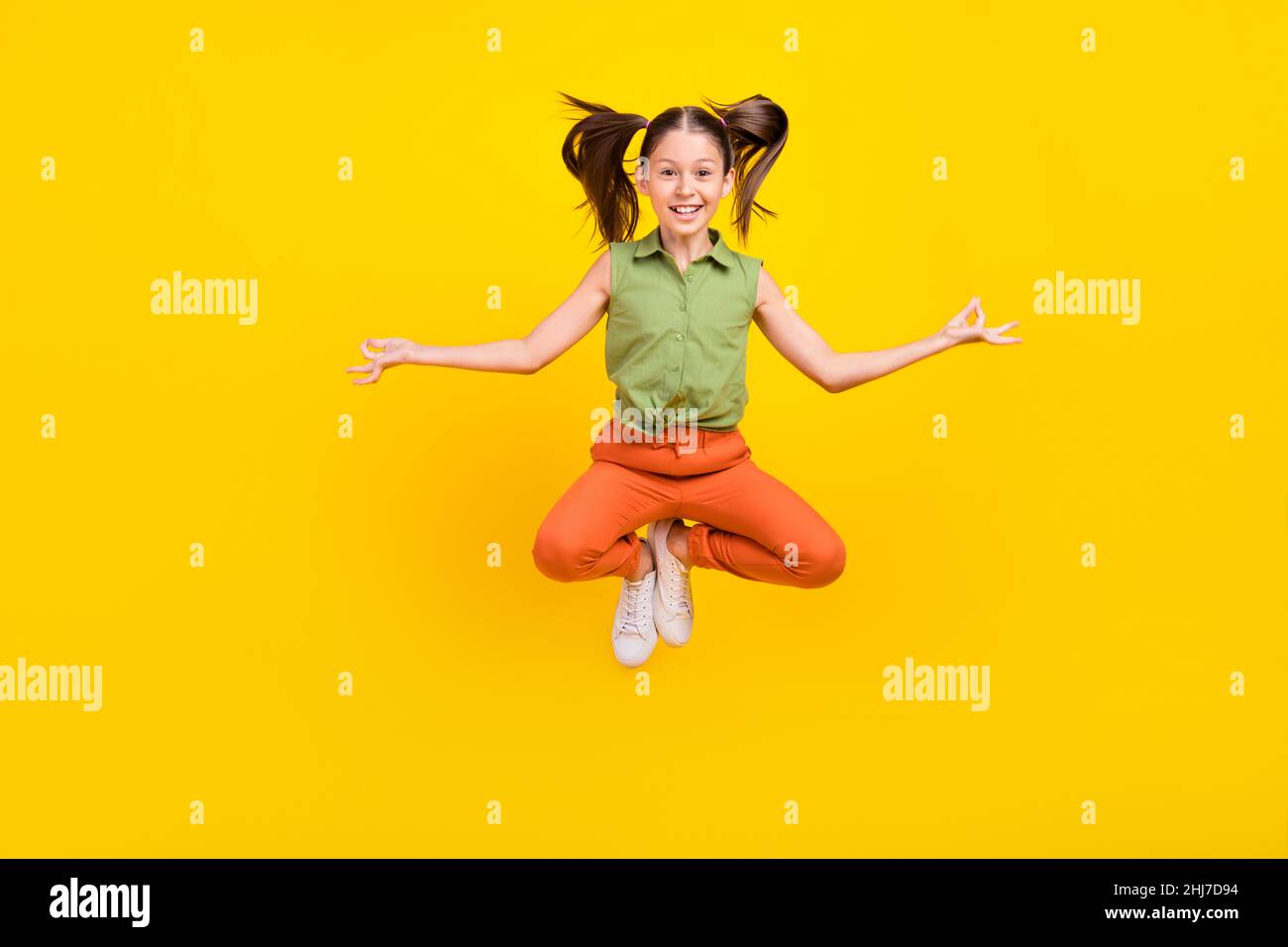 Photo of sweet funky student girl wear green shirt smiling jumping high ...