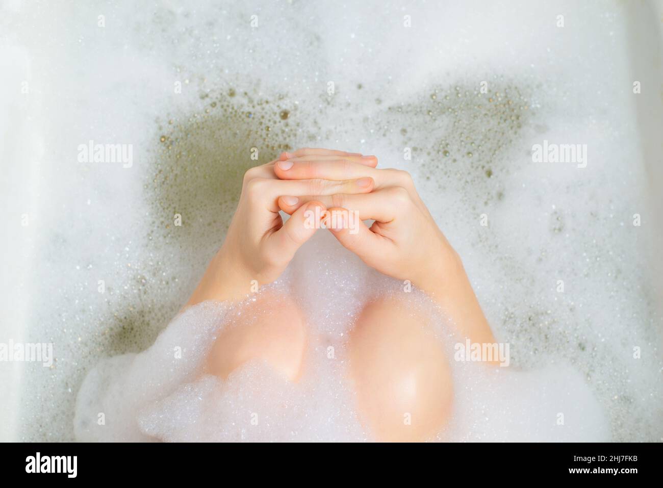Relaxation, reflection, thoughtfulness in a bubble bath concept. Women ...