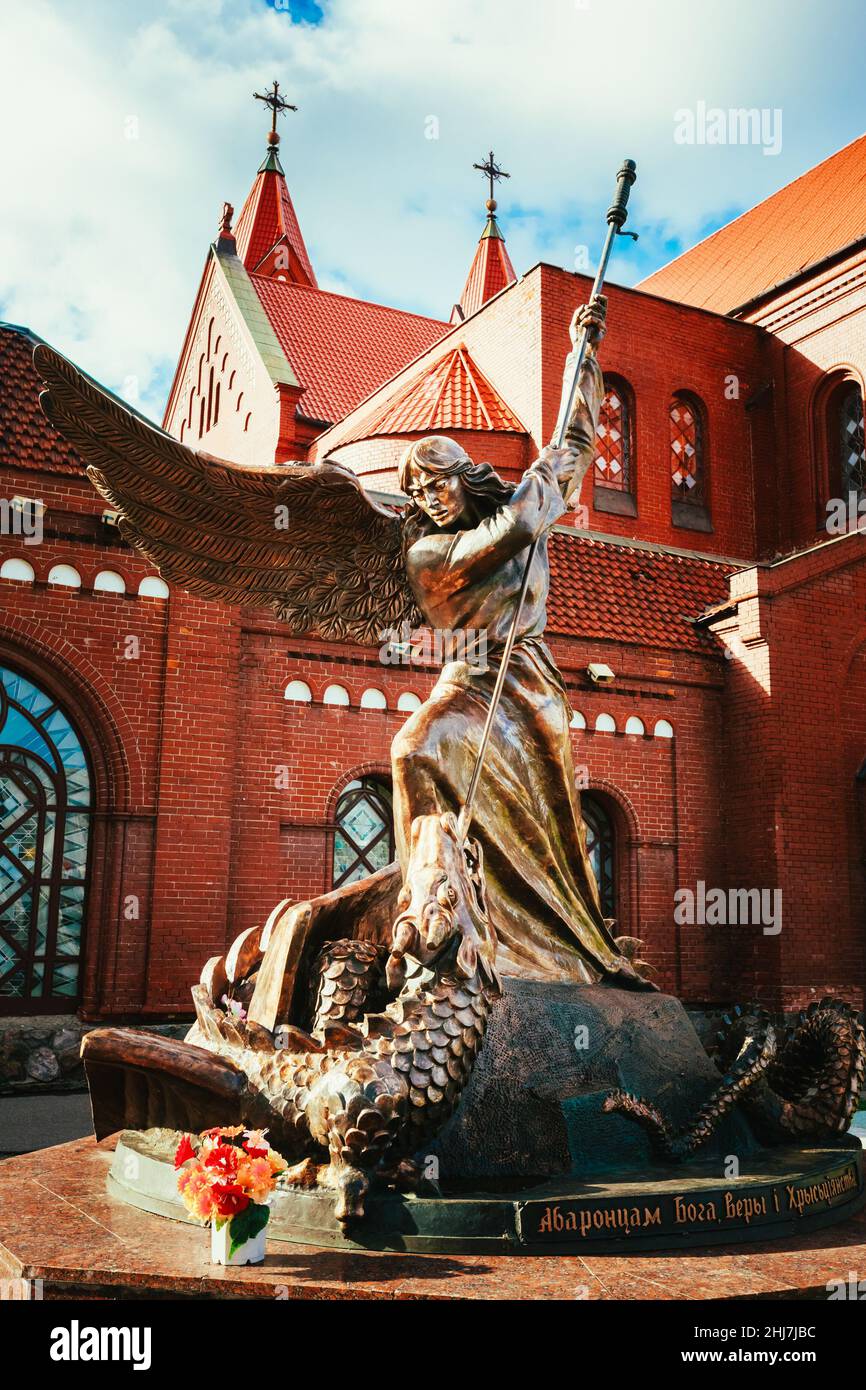 Statue of Archangel Michael with outstretched wings, thrusting spear ...