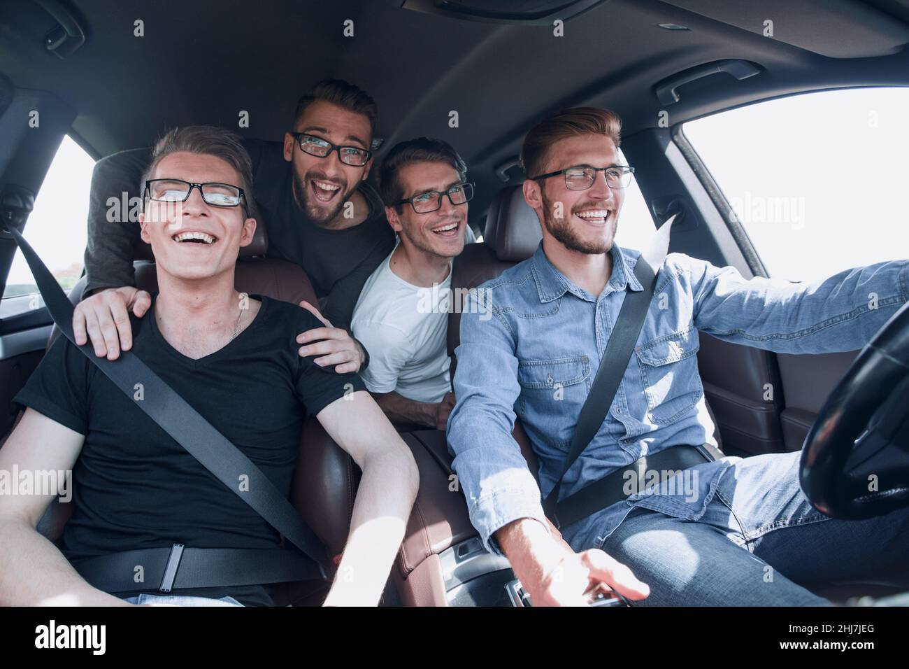 close up. a group of friends traveling in a car . the concept of speed ...