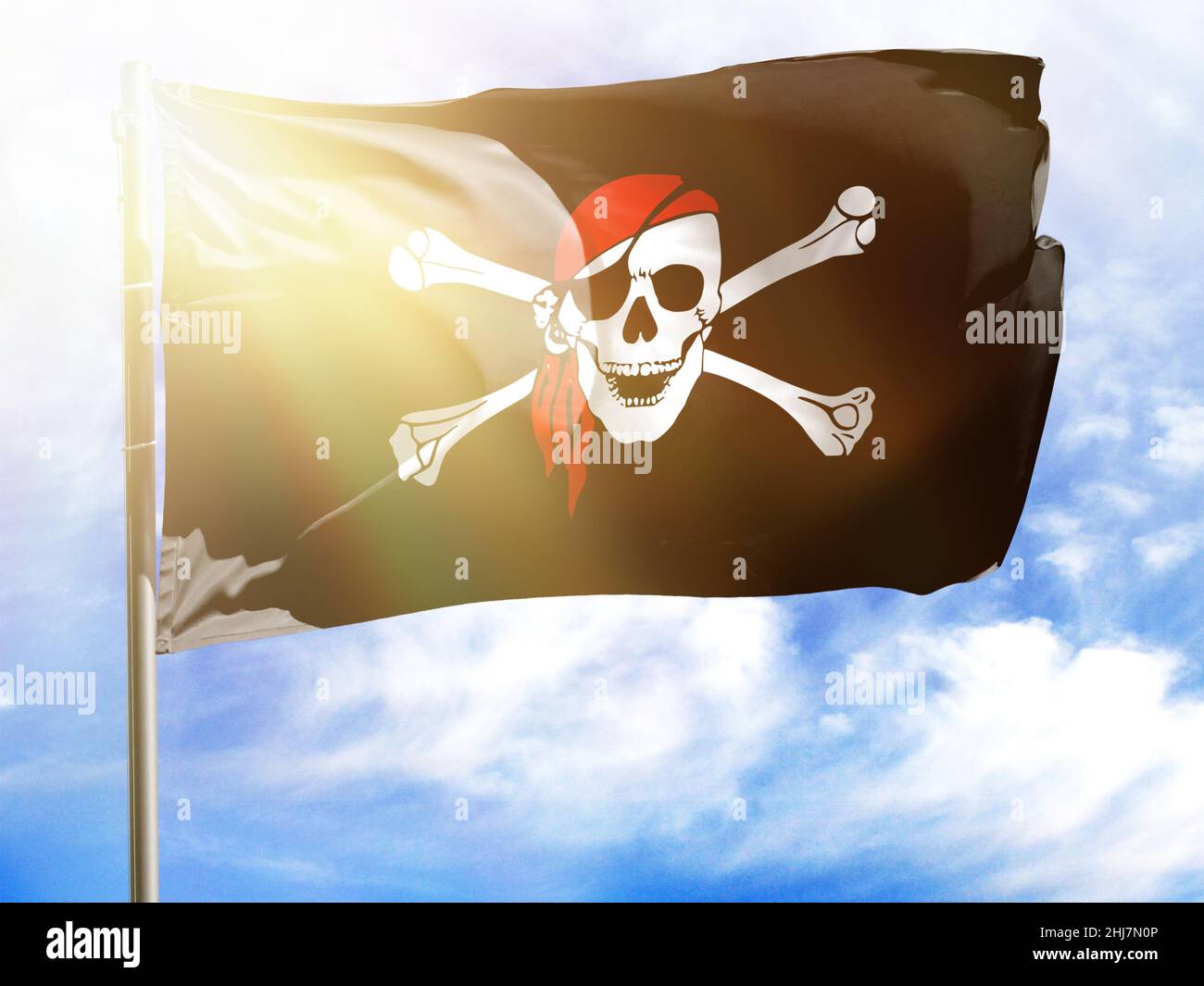 Jolly roger pirate flag fluttering hi-res stock photography and images ...