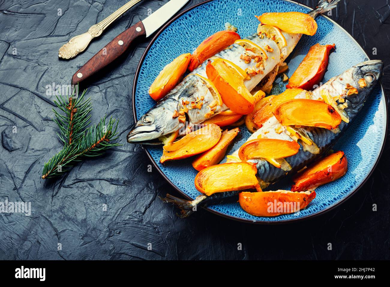 Healthy food, baked mackerel. Fish in persimmon fruit Stock Photo - Alamy