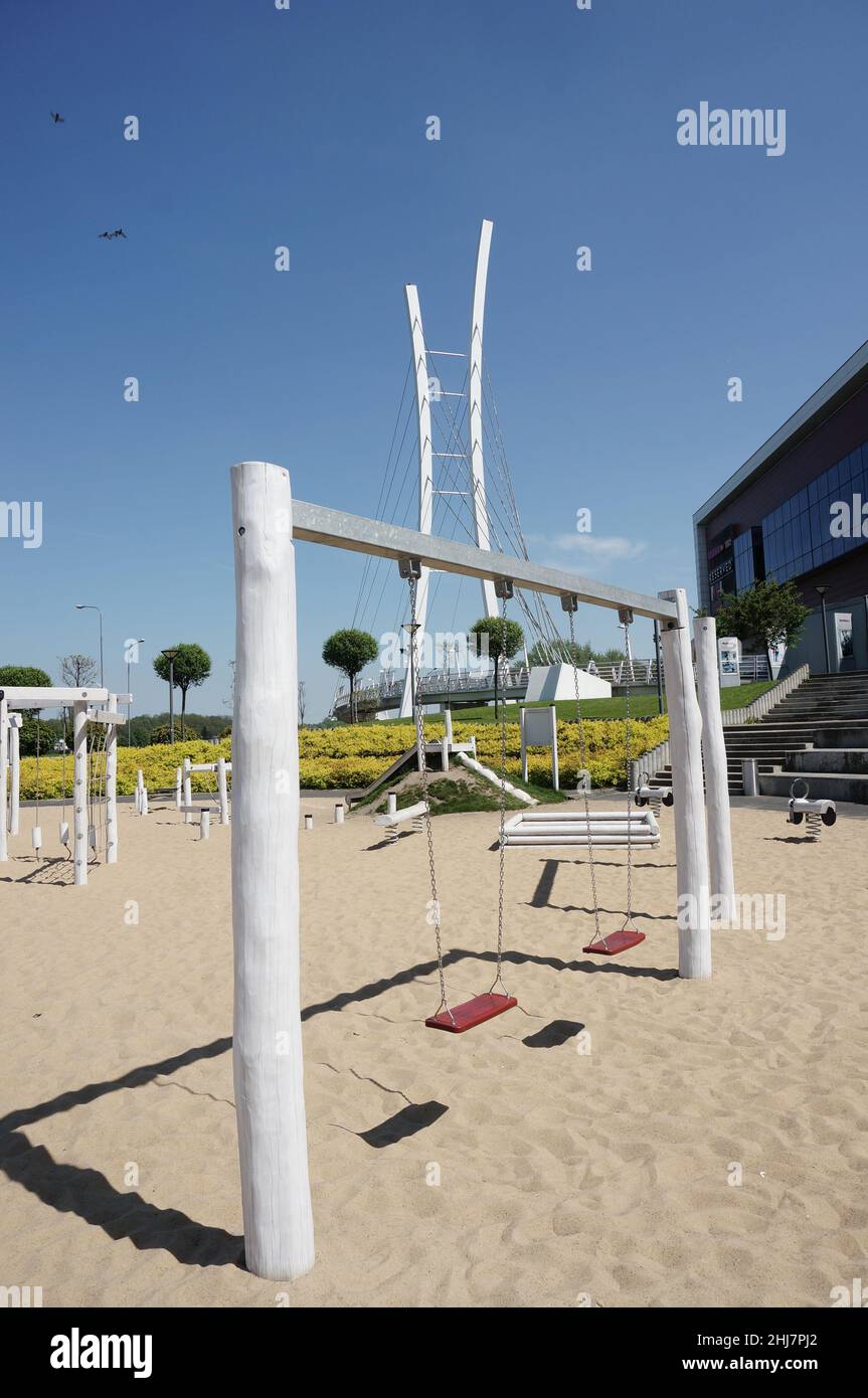 Swing set of a playground next to the Galeria Malta shopping mall ...