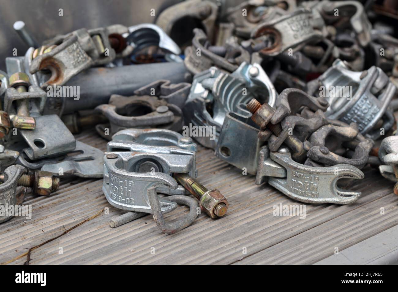 A pile of metal tool pieces used in buildings. Closeup color image ...