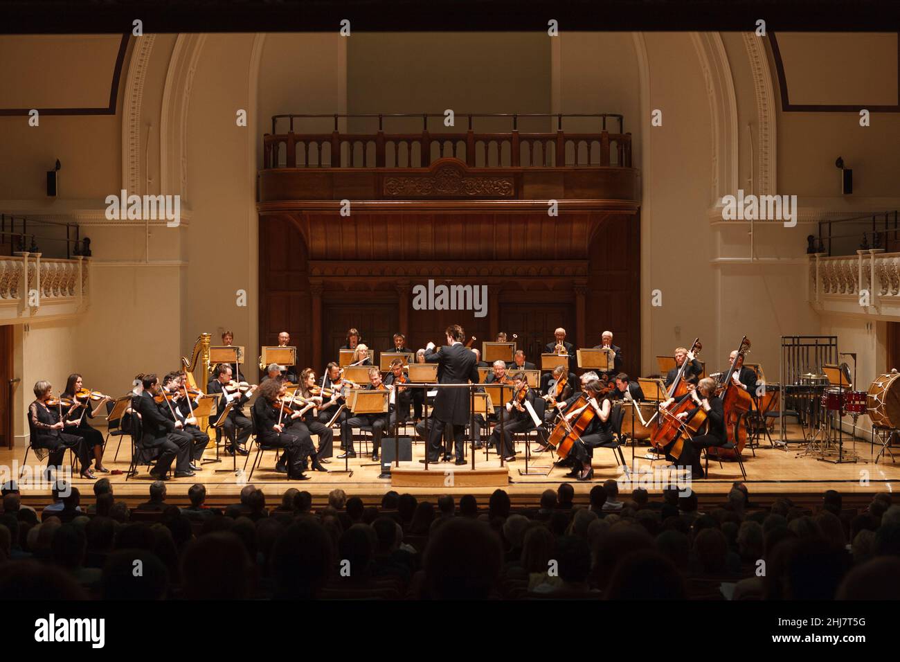 British composer and conductor Benjamin Wallfisch conducting a ...