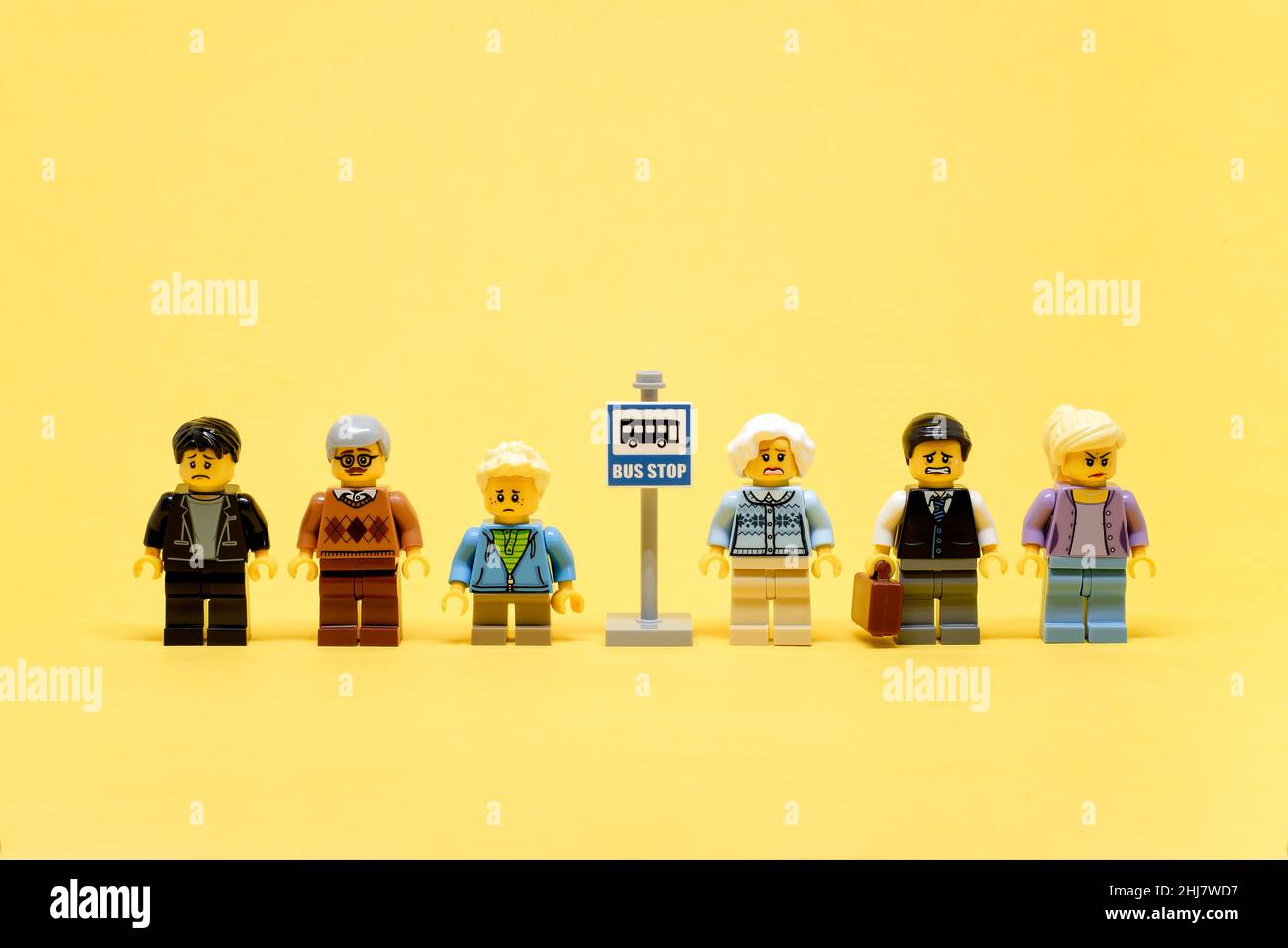 Group of various sad people waiting at bus stop. Illustrative editorial ...