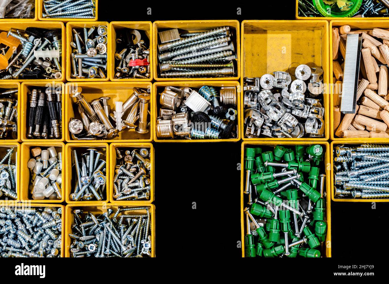 Yellow case with small construction objects. Many storage compartments ...