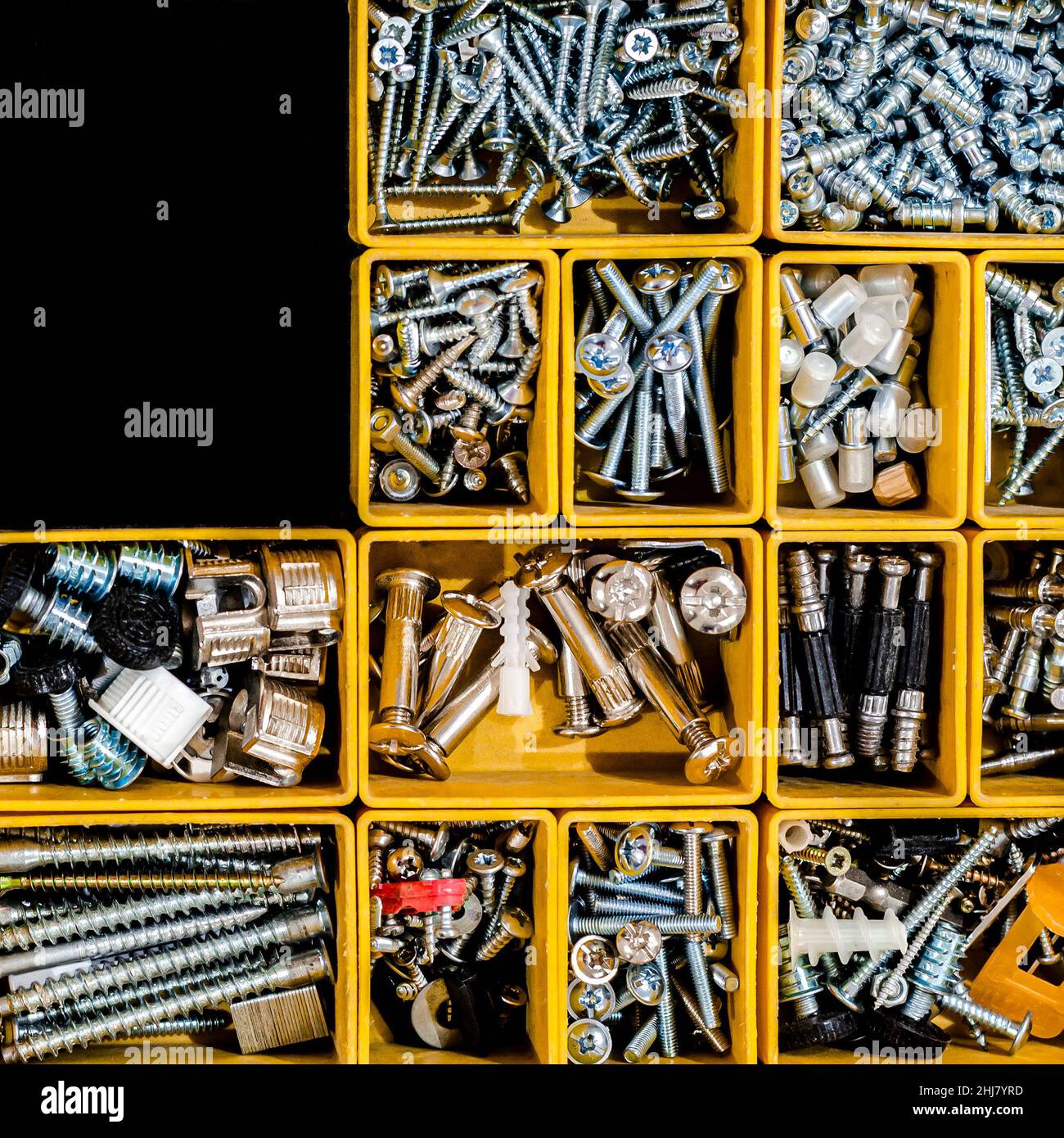 Yellow case with small construction objects. Many storage compartments ...