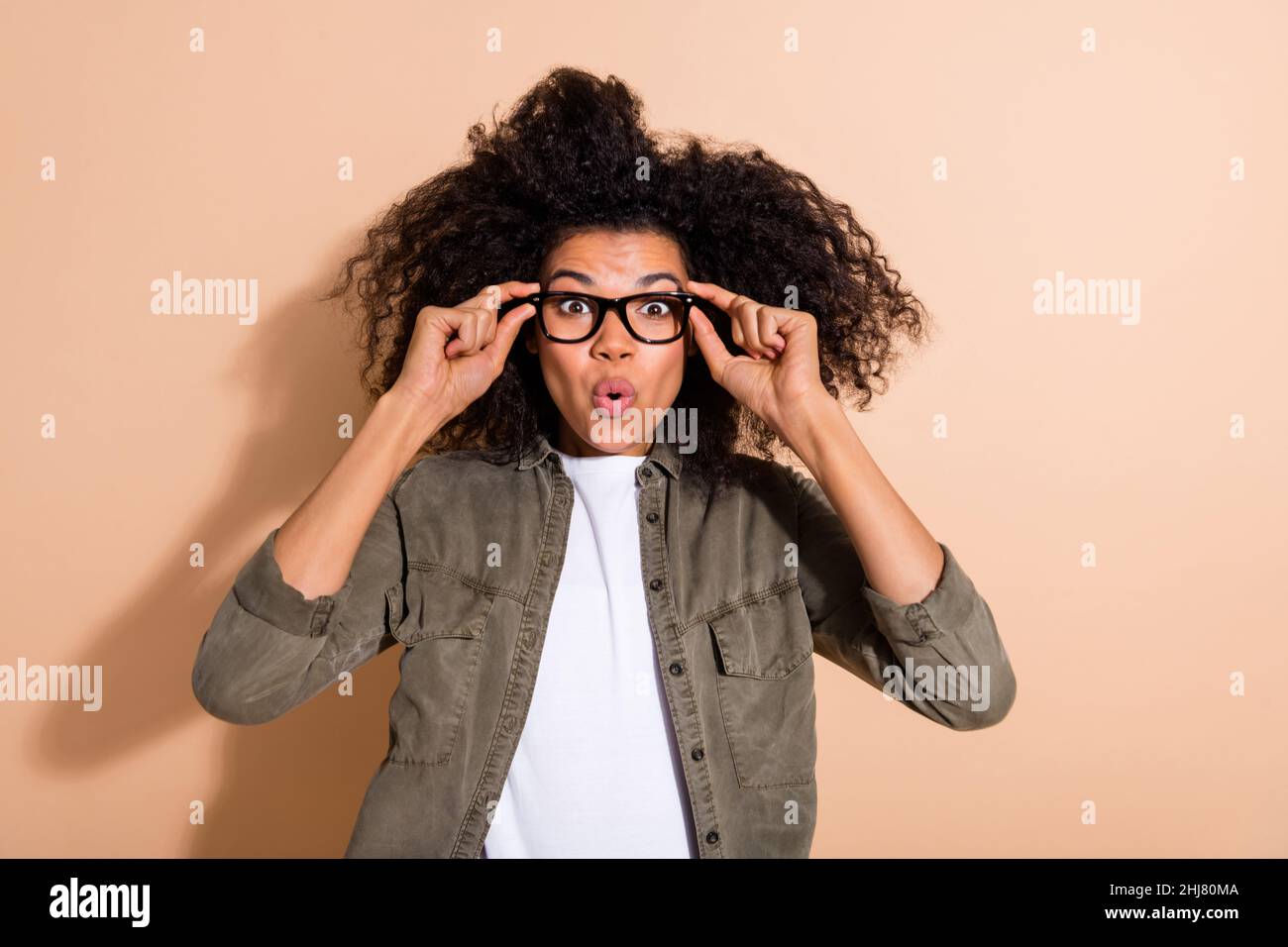 Portrait Of Attractive Trendy Stunned Amazed Girl Touching Specs Pout