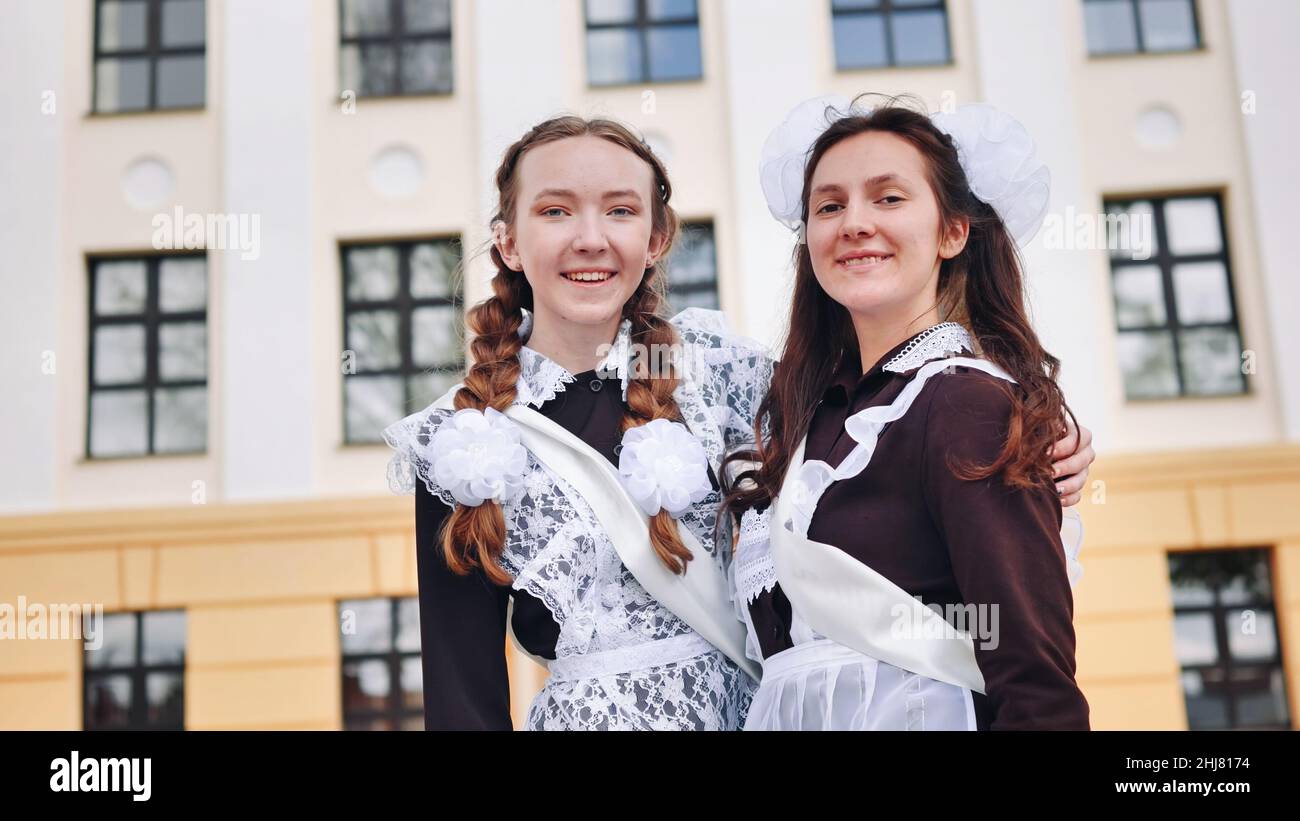 Happy Russian schoolgirls hug on their last school day Stock Photo - Alamy