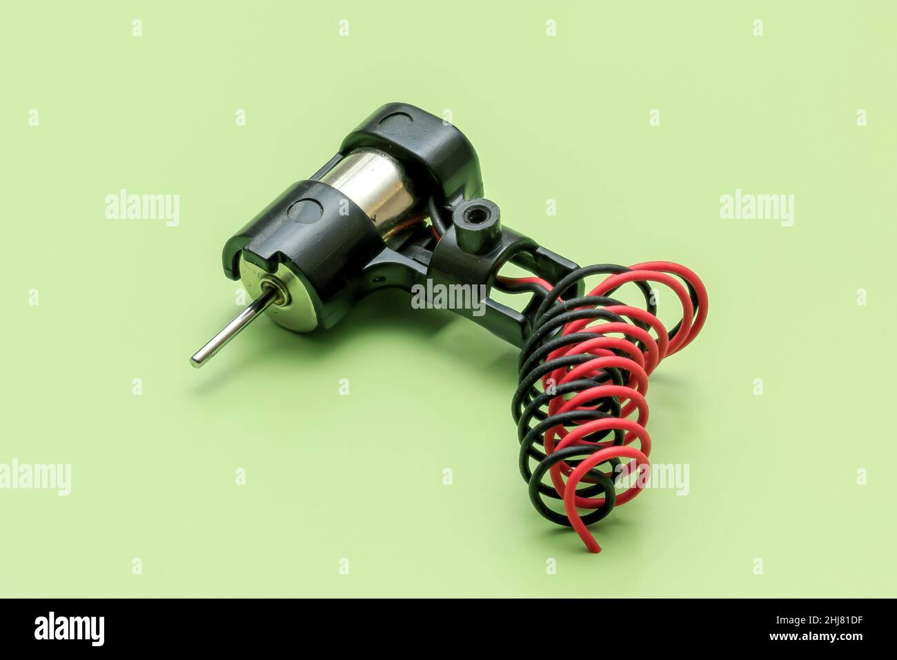 Closeup on a miniature electric motor fitted in a plastic housing ...