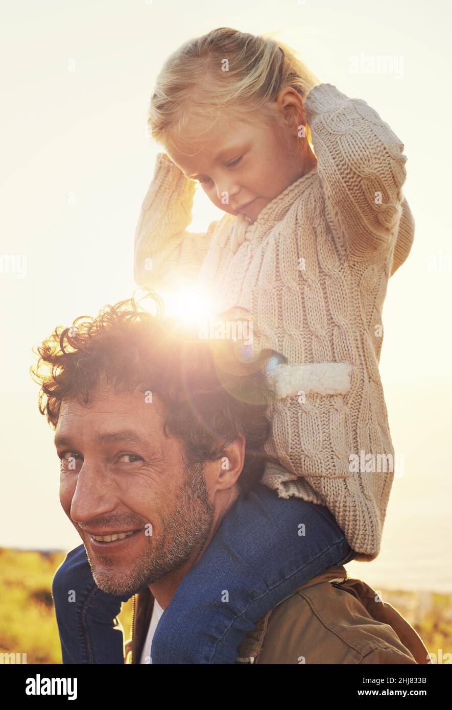 Happy girl sitting on the shoulders of adult male hi-res stock photography and images - Alamy