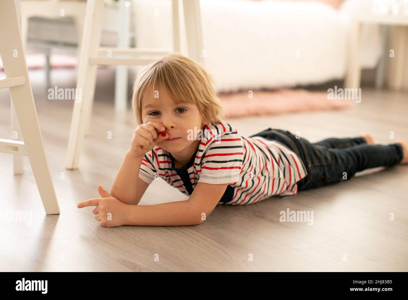 Cute little child, toddler boy, eating alfa omega 3 child suplement ...