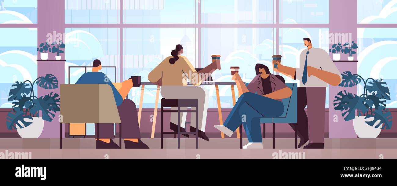 mix race businesspeople sitting at cafe table and drinking coffee ...