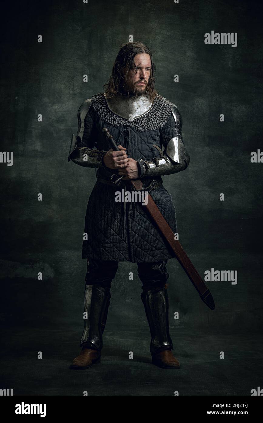 Vintage style portrait of brutal seriuos man, medieval warrior or ...