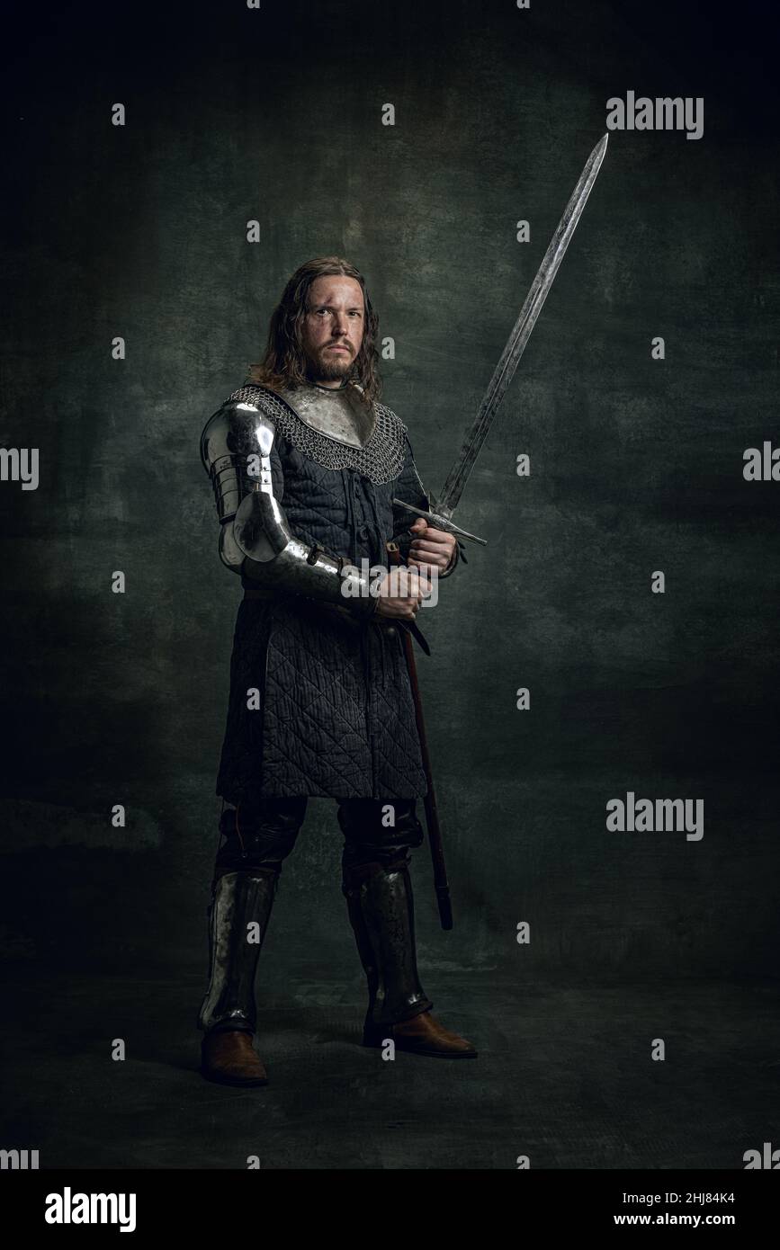 Vintage style portrait of brutal seriuos man, medieval warrior or ...