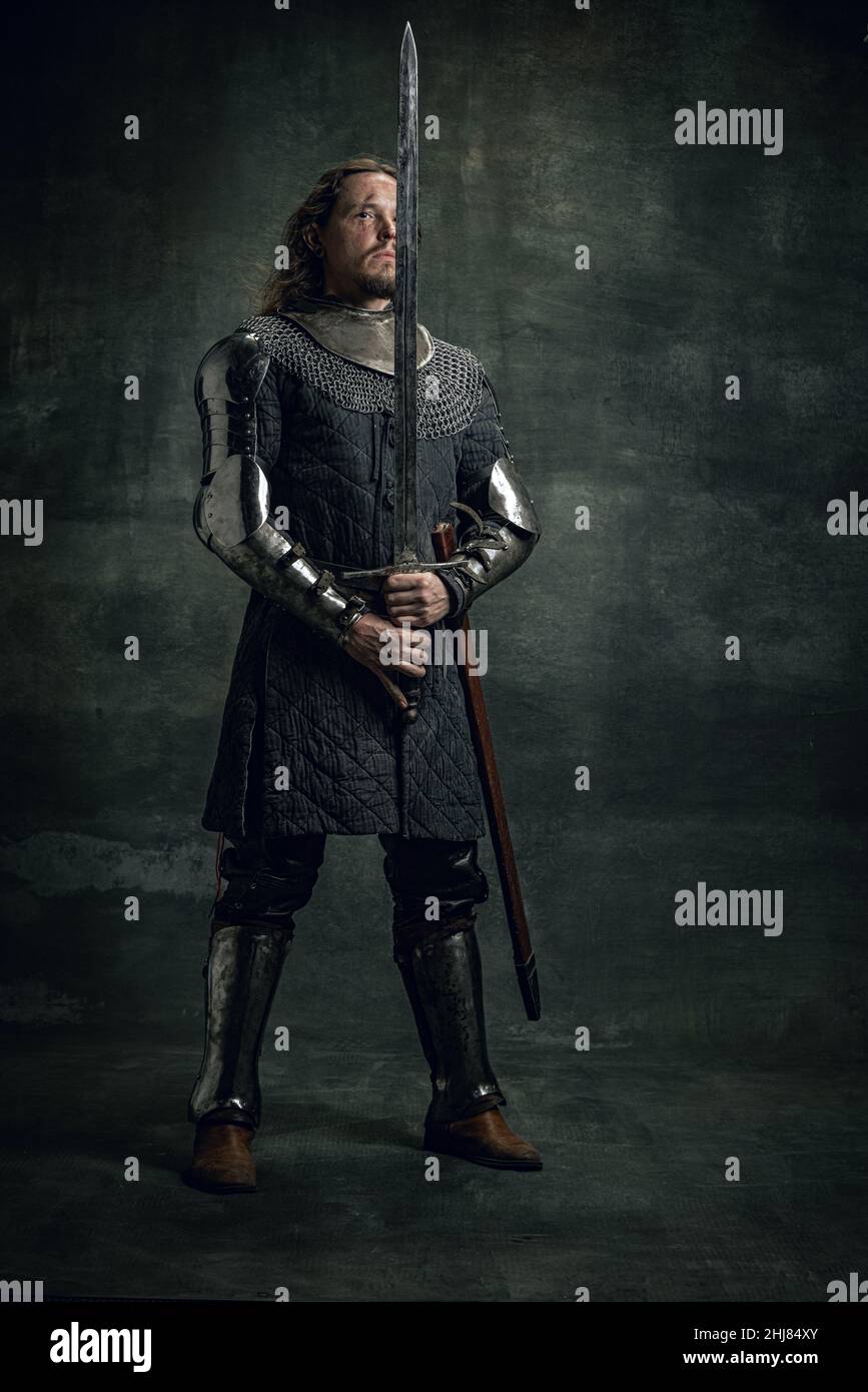 Vintage style portrait of brutal seriuos man, medieval warrior or ...