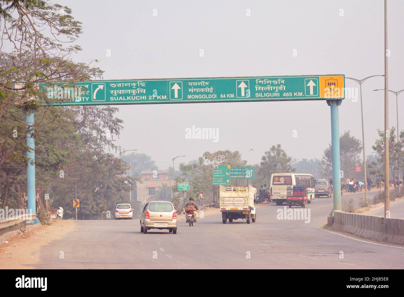 A Road Direction Board on National Highway 37 of Assam showing distance ...