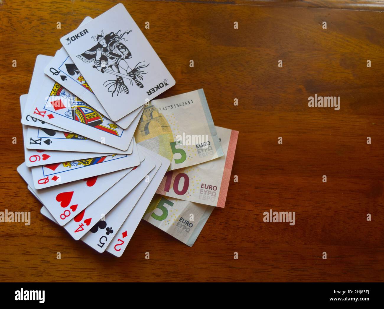 Playing cards with Euro banknotes Stock Photo - Alamy