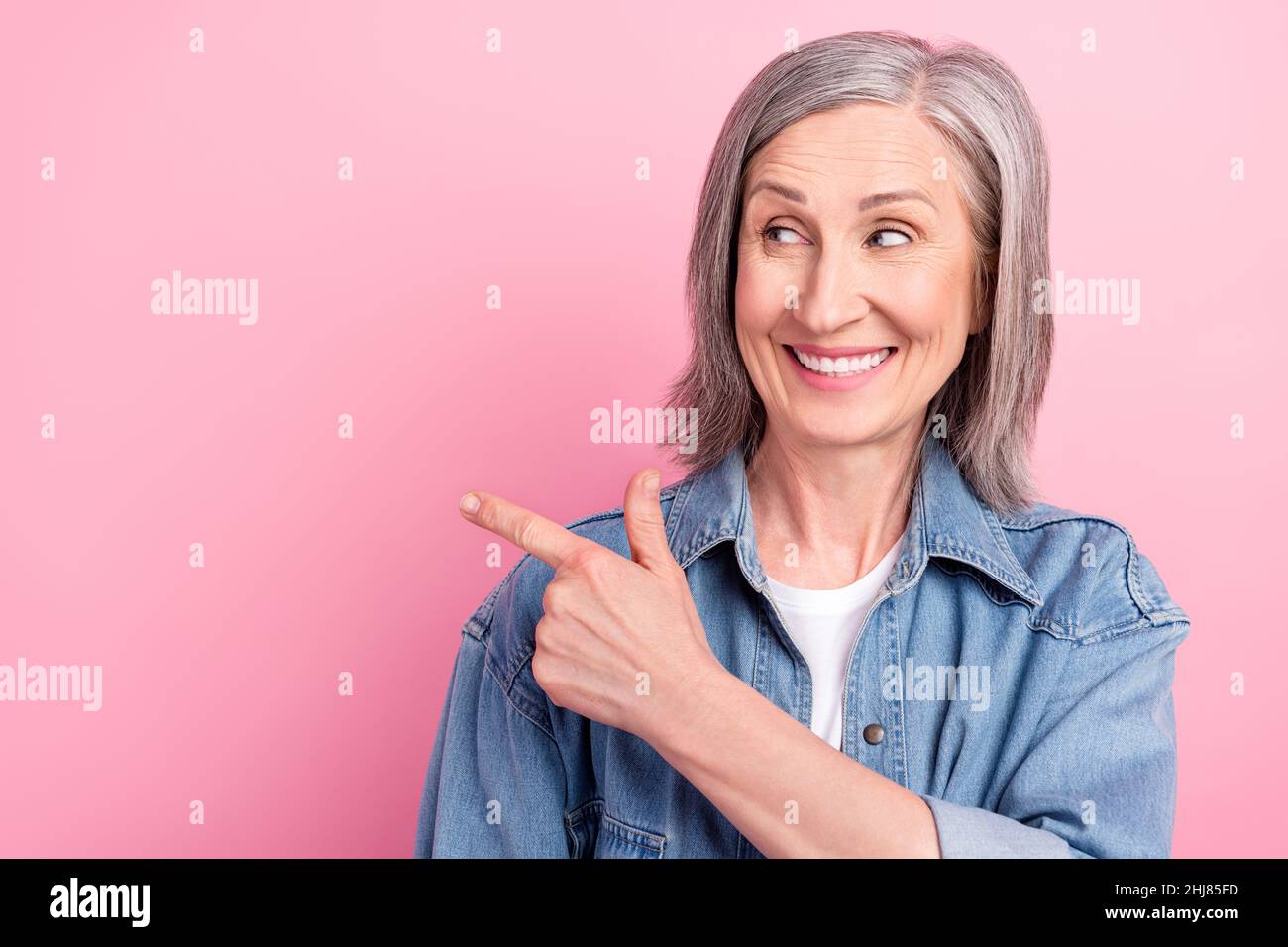 Photo of old lovely happy lady point finger empty space comment sale ...