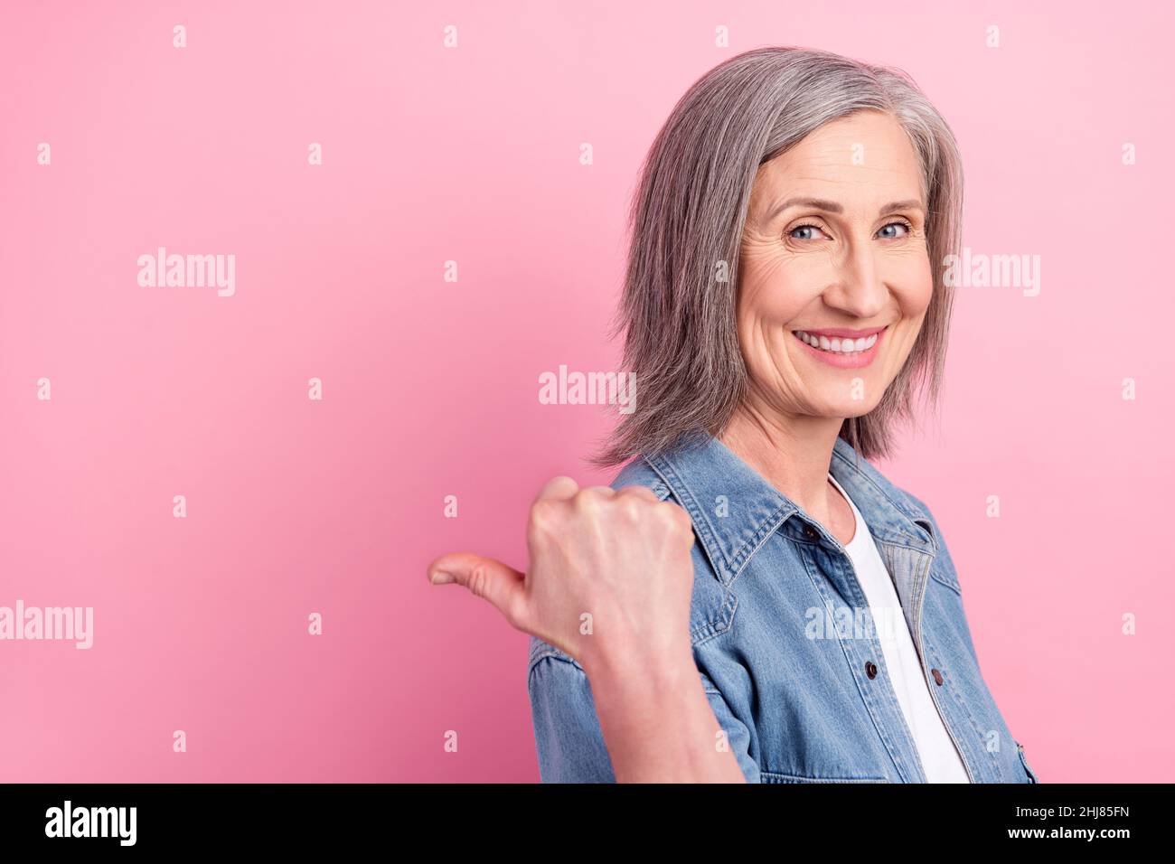 Profile photo of modern aged lady point empty space wear blue jacket ...