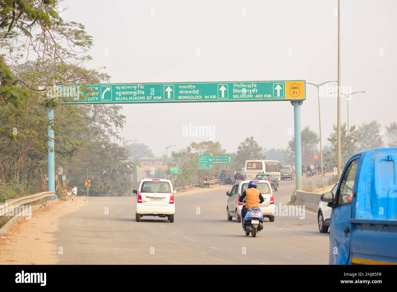 A Road Direction Board on National Highway 37 of Assam showing distance ...