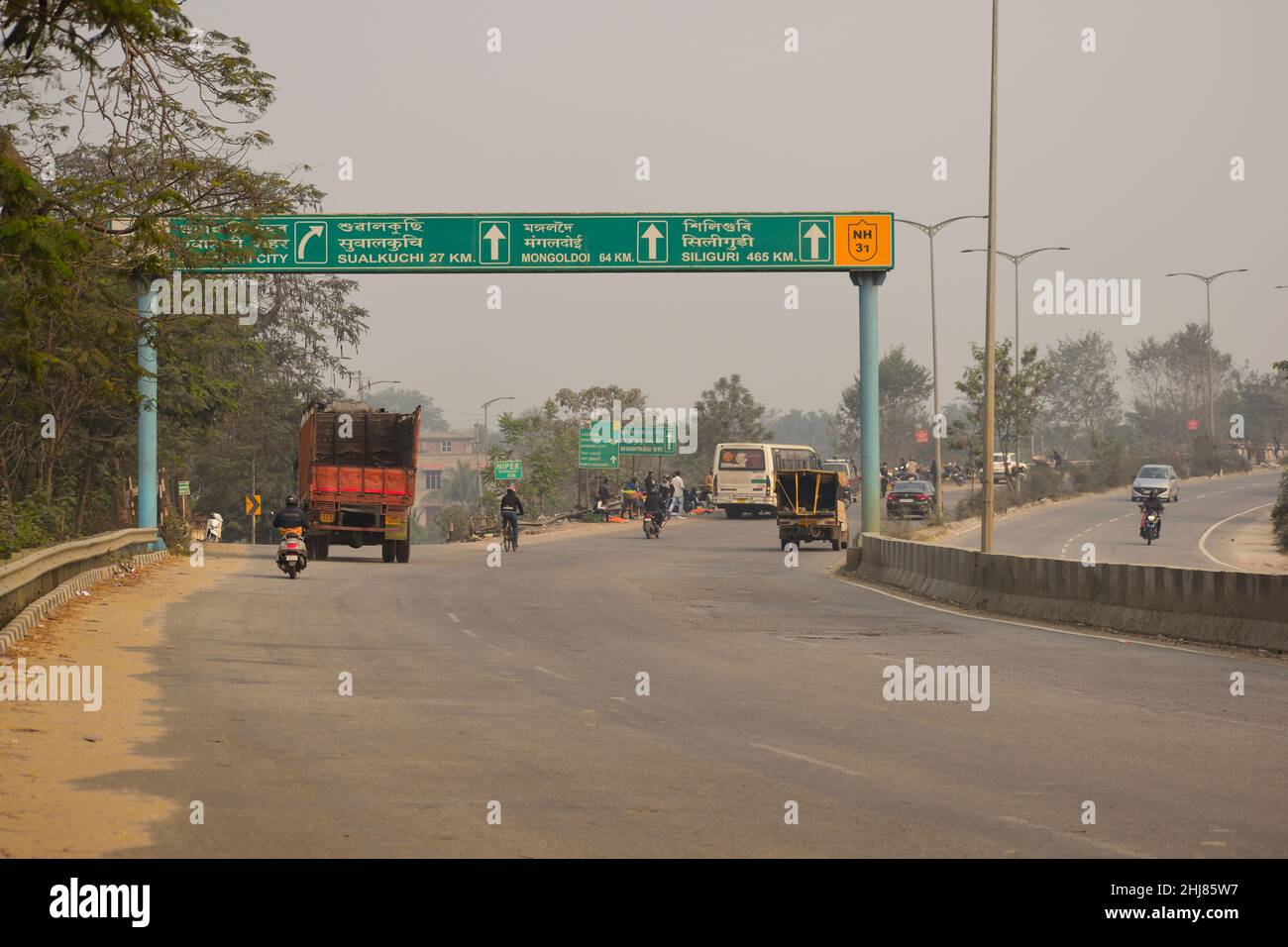 A Road Direction Board on National Highway 37 of Assam showing distance ...